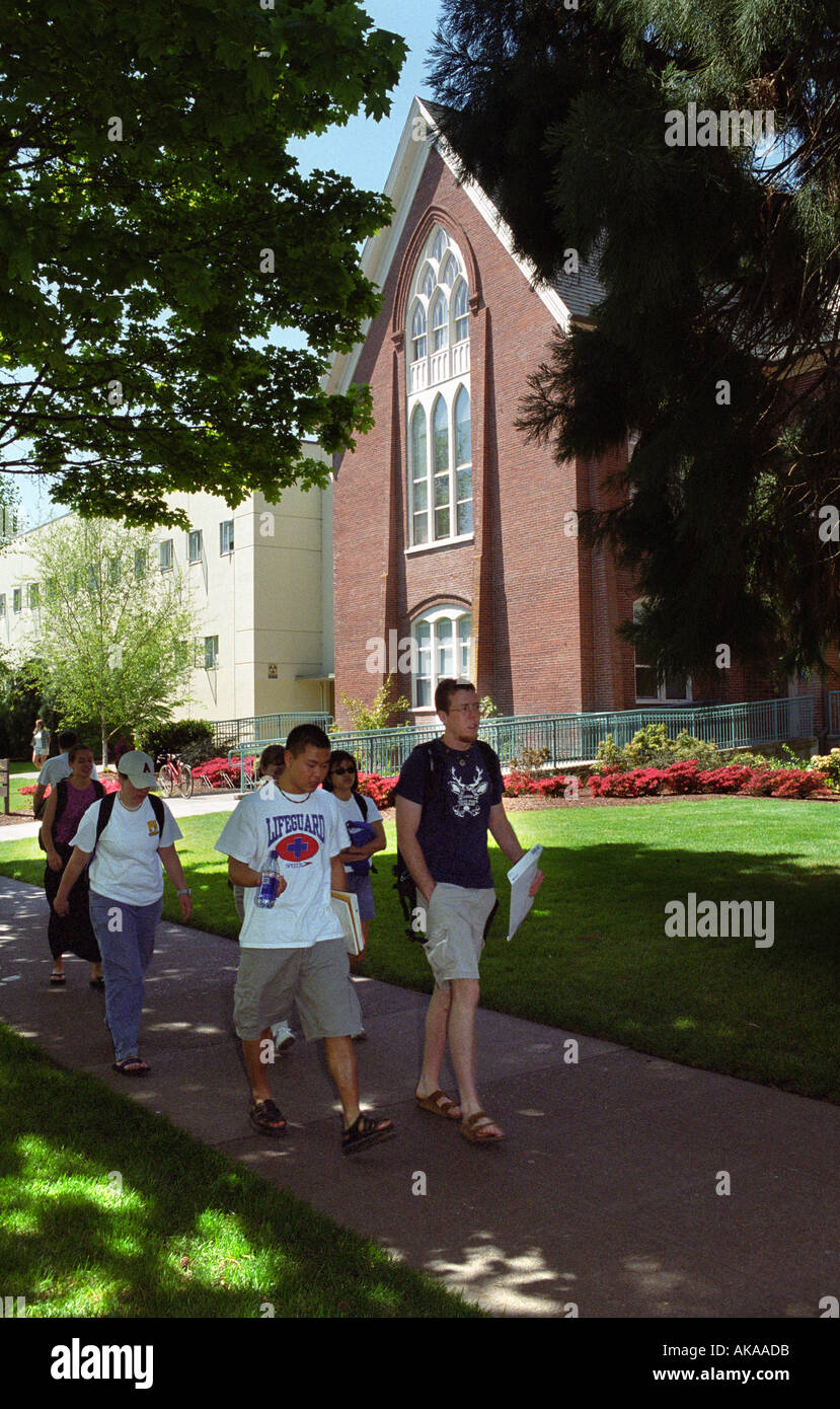 College students walk along sidewalk at Western Oregon University Stock ...