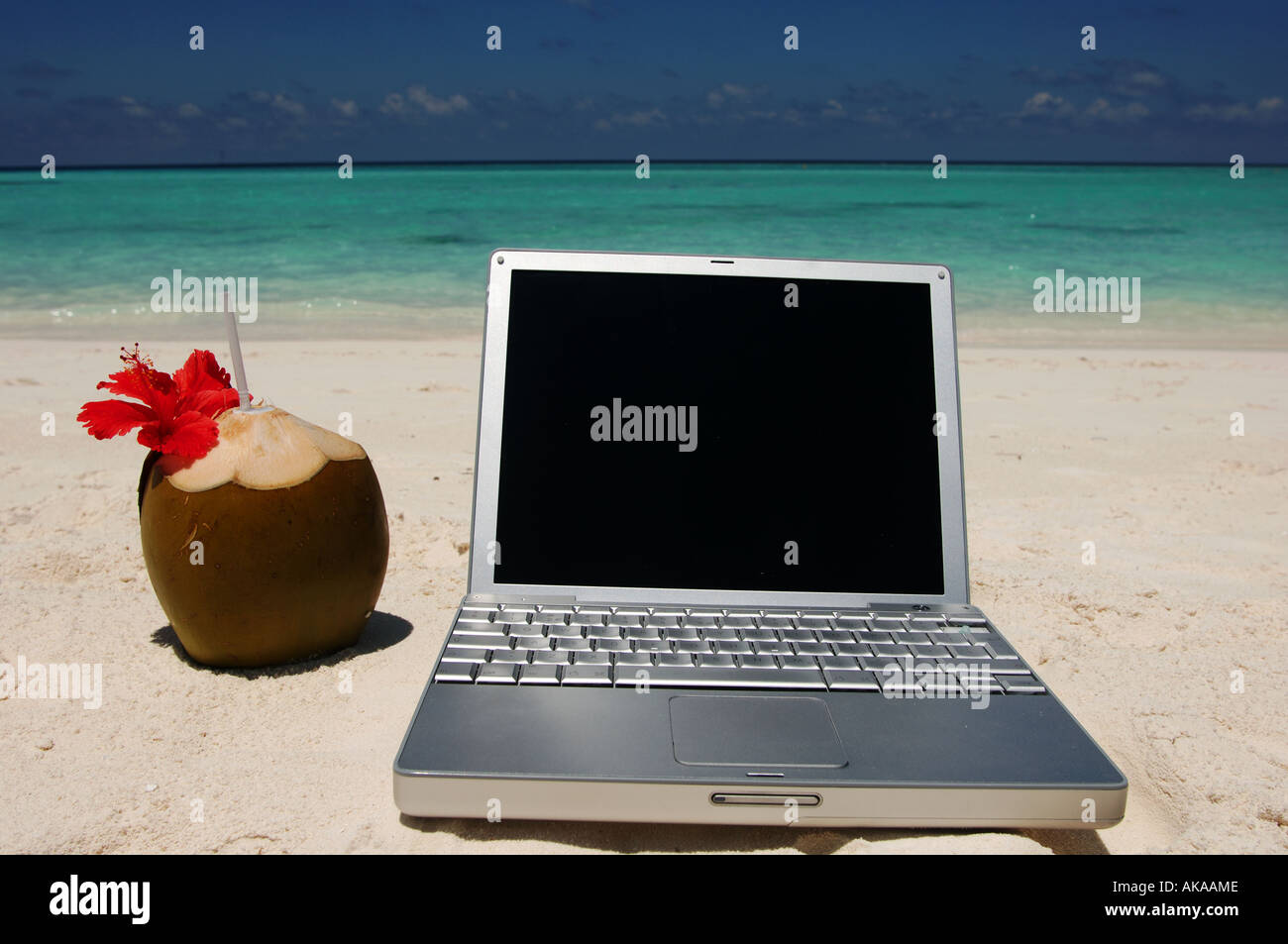 Maldives laptop on beach Stock Photo - Alamy