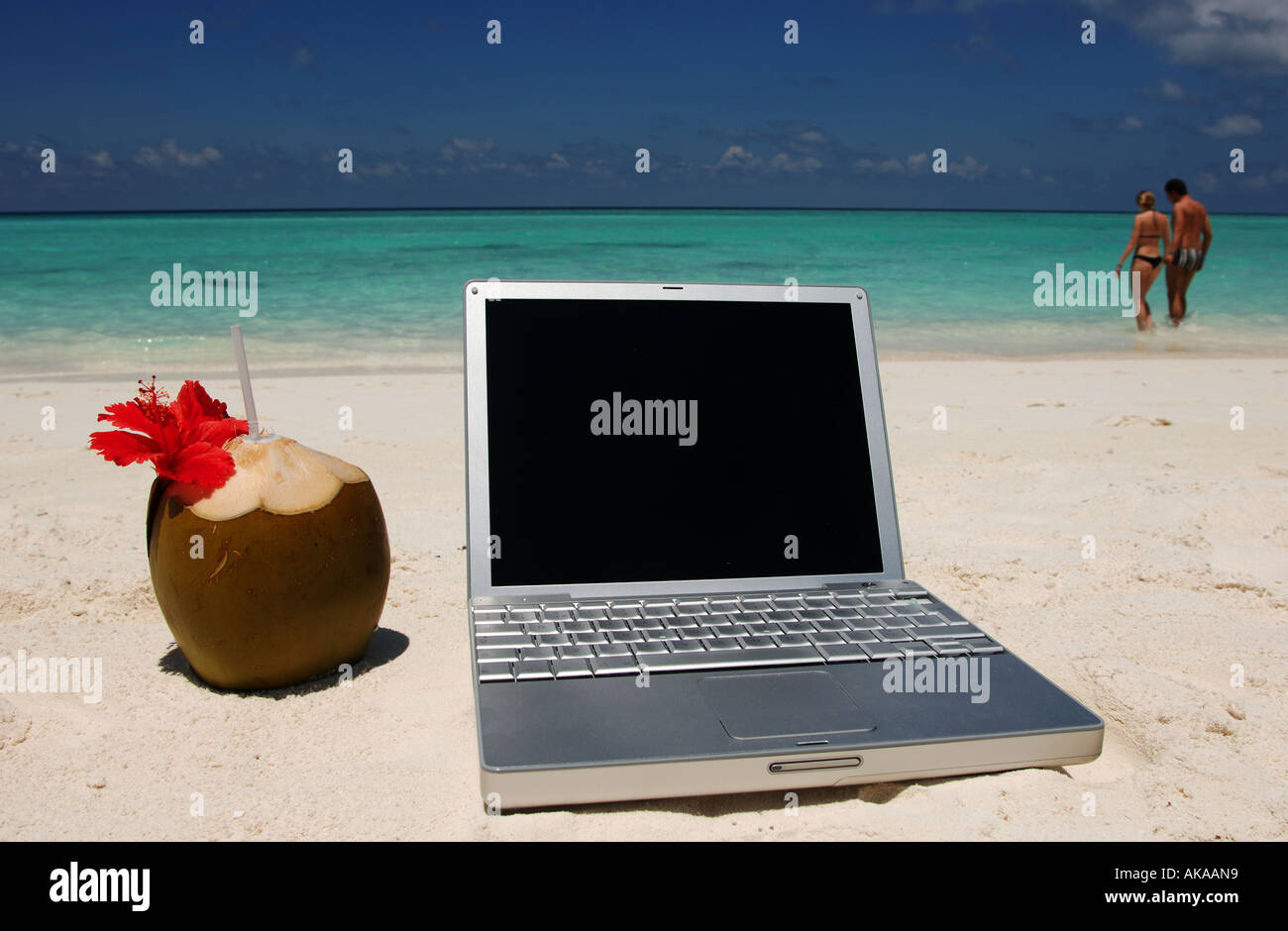 Maldives laptop on beach Stock Photo - Alamy