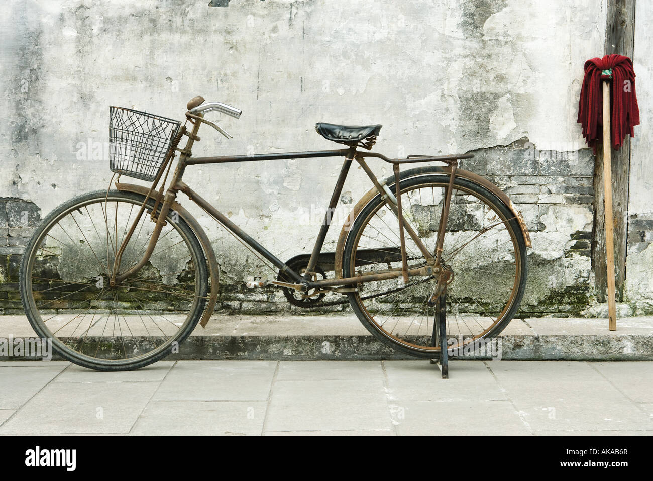 Bicycle and mop Stock Photo - Alamy
