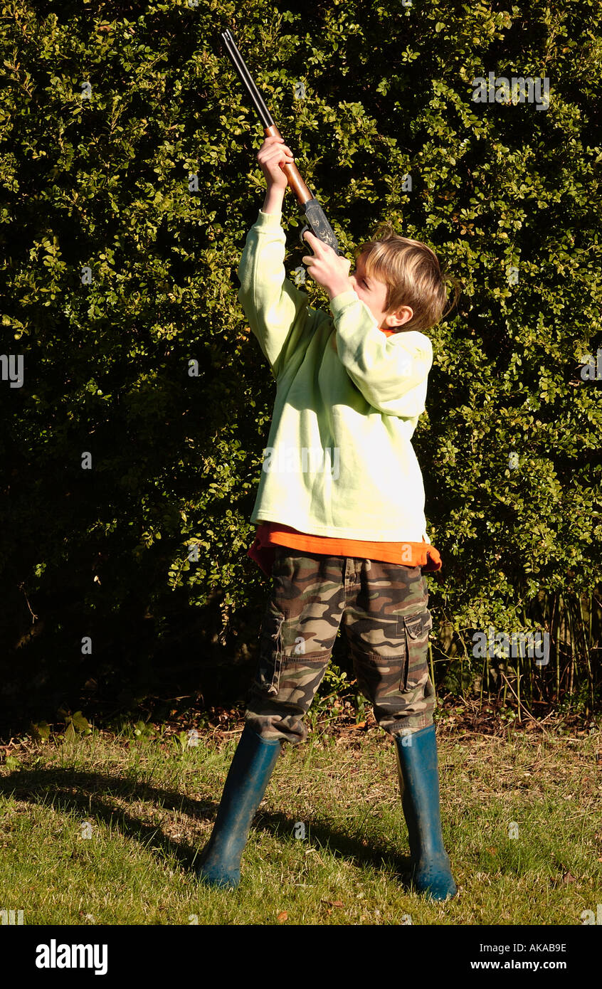boy and toy gun Stock Photo - Alamy