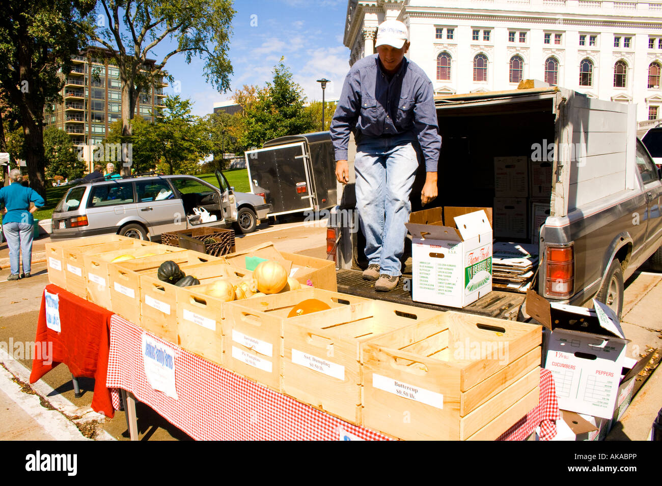 man packing crates at the Madison Wisconsin building market saturday ...