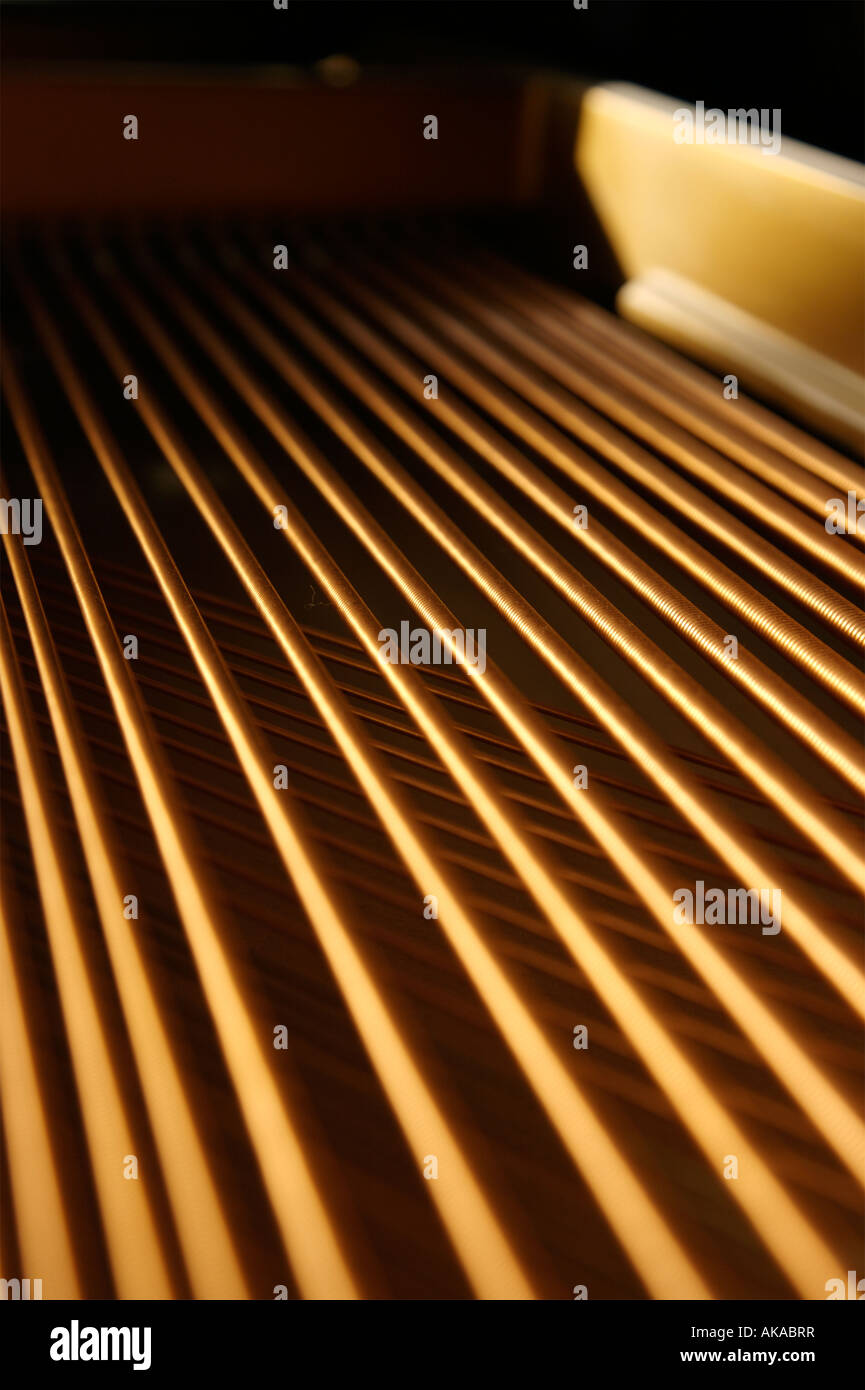 Gold Piano Strings Stock Photo - Alamy