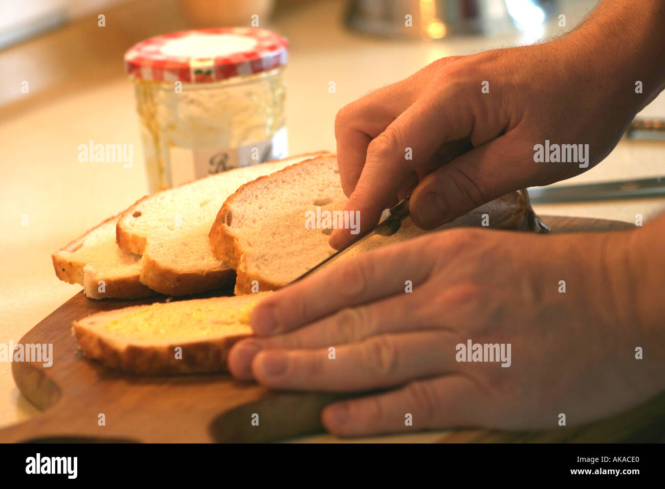 Man buttering bread hi-res stock photography and images - Alamy