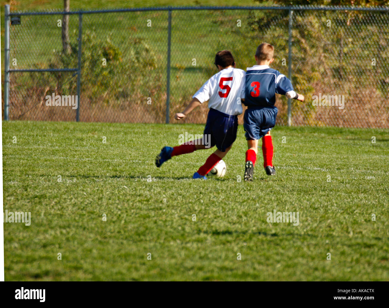 This is a picture of two young boys playing soccer Stock Photo - Alamy