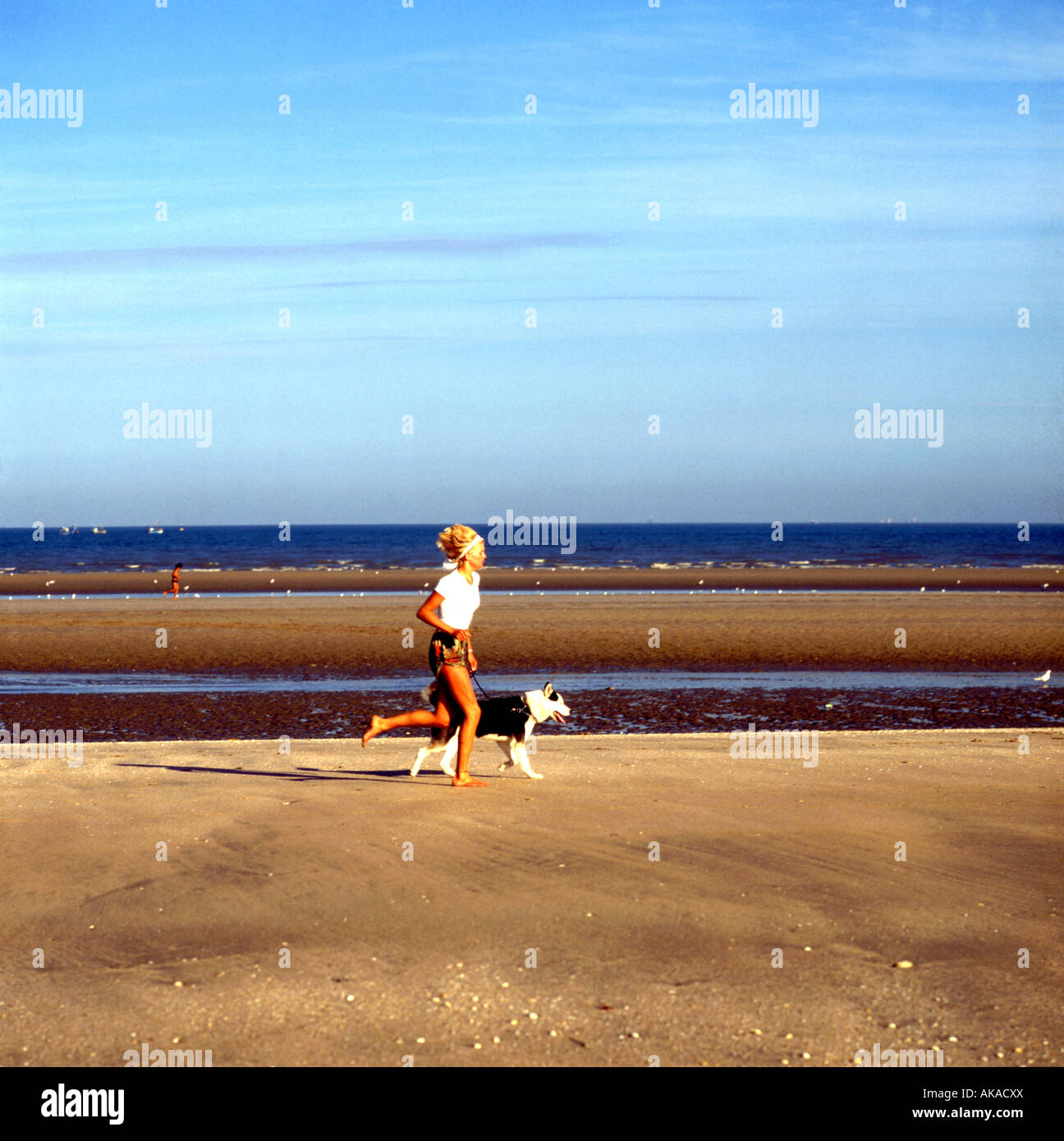 Jogging on beach Stock Photo - Alamy