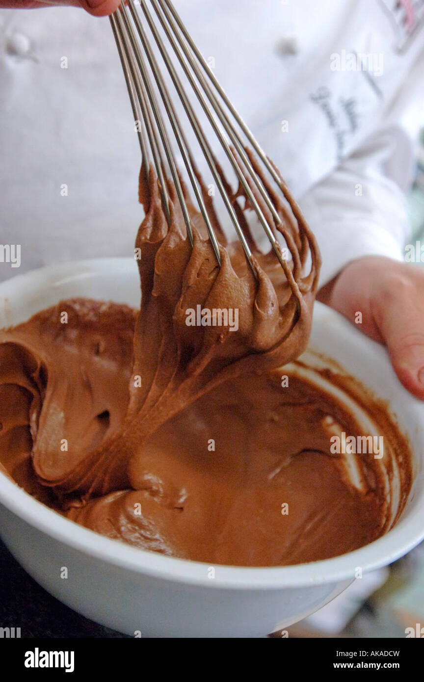 Whisking cake mixture Stock Photo - Alamy