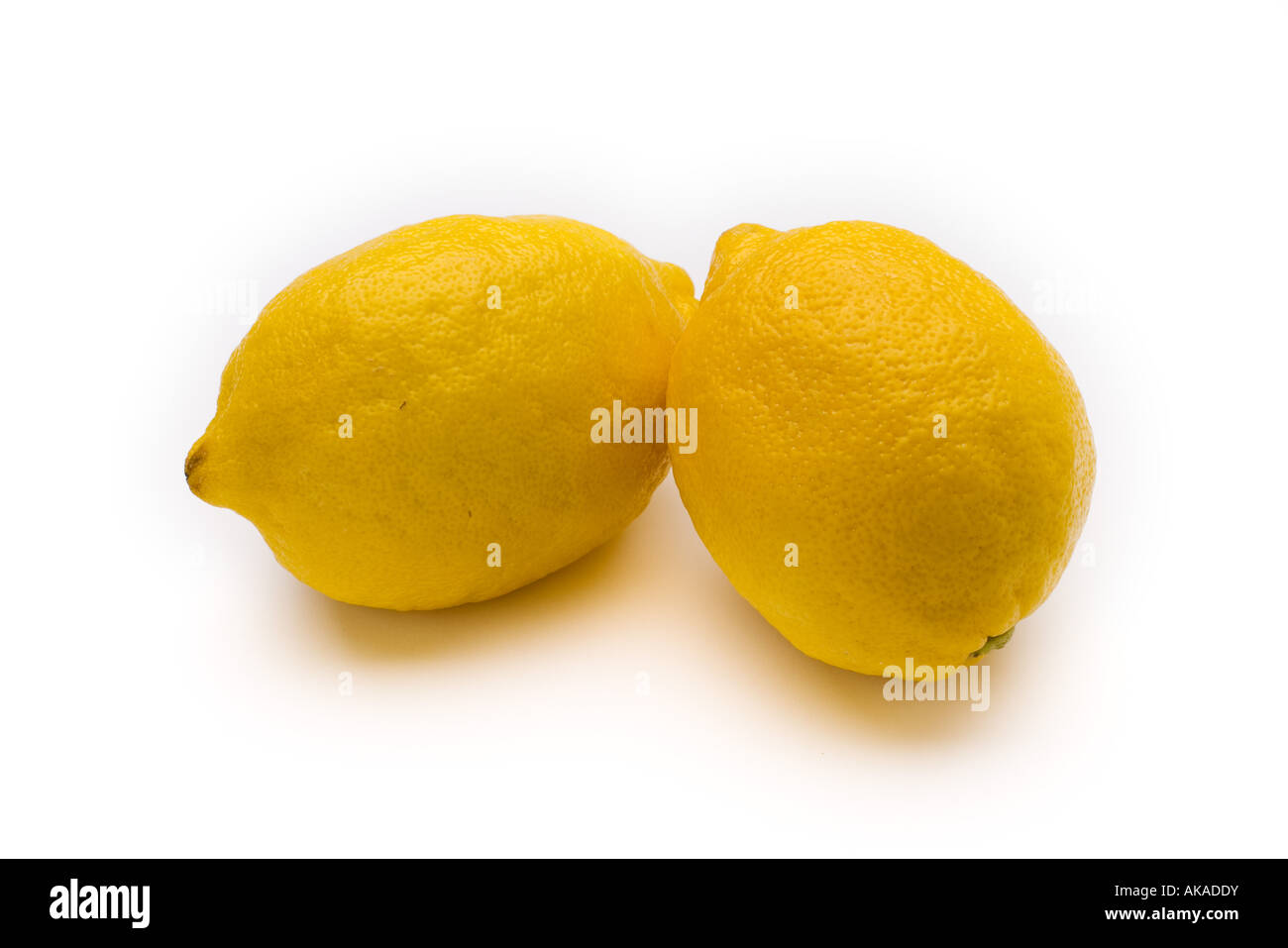Two lemons on a white background Stock Photo - Alamy
