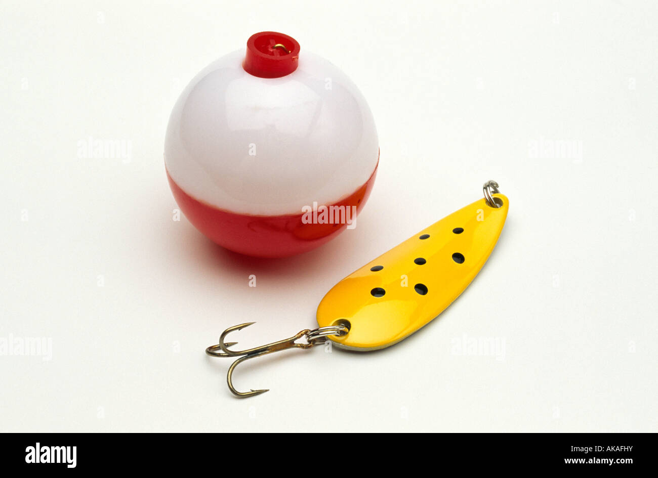 Fishing lure and float Stock Photo - Alamy