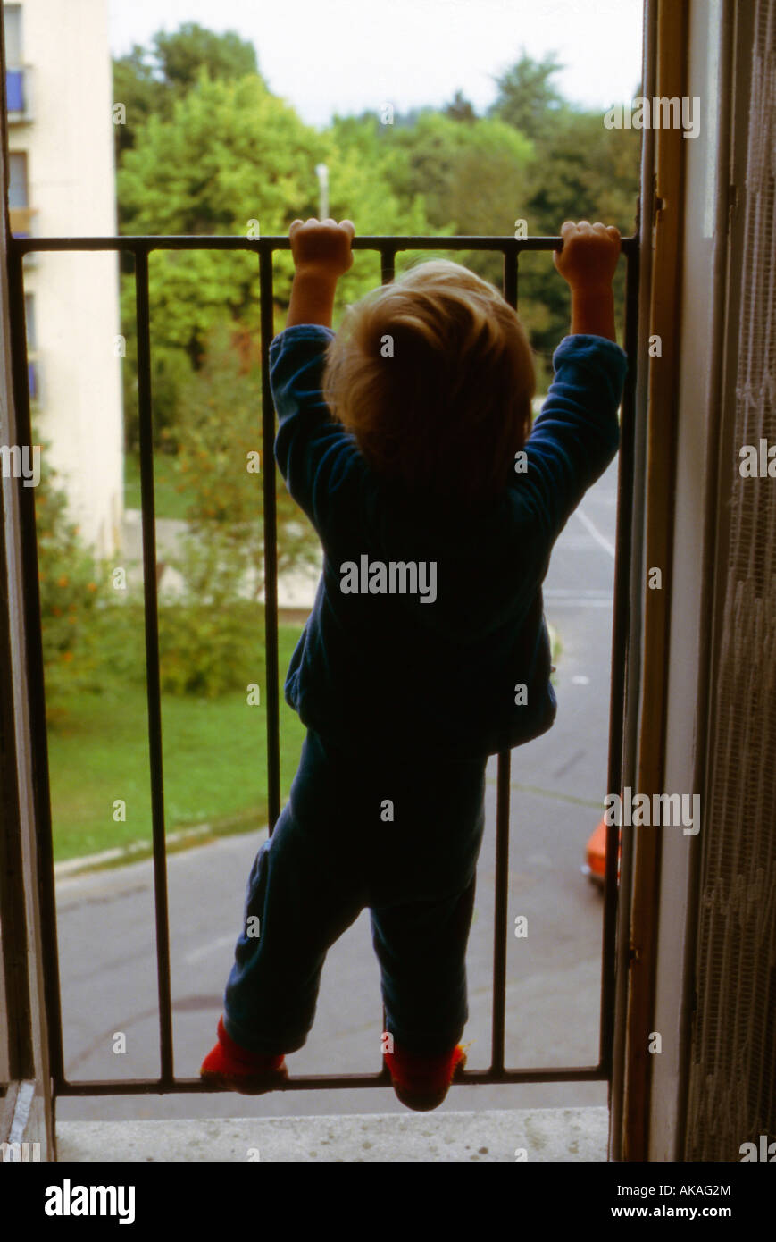 Little boy in window Stock Photo - Alamy