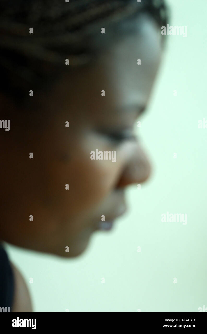 Young Black Woman Looking Contemplative Stock Photo - Alamy