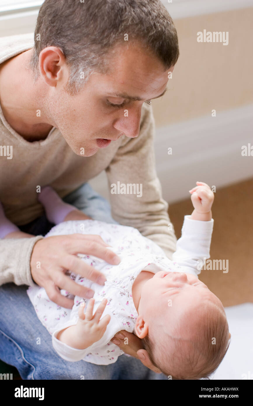 Stressed father crying baby hi-res stock photography and images - Alamy