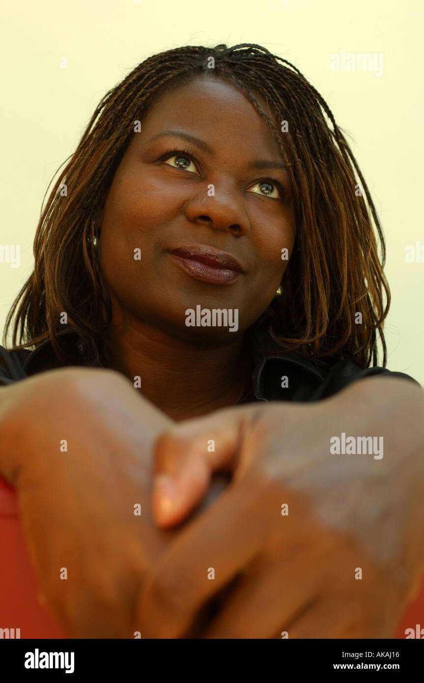 Young Black Woman Looking Contemplative Stock Photo - Alamy