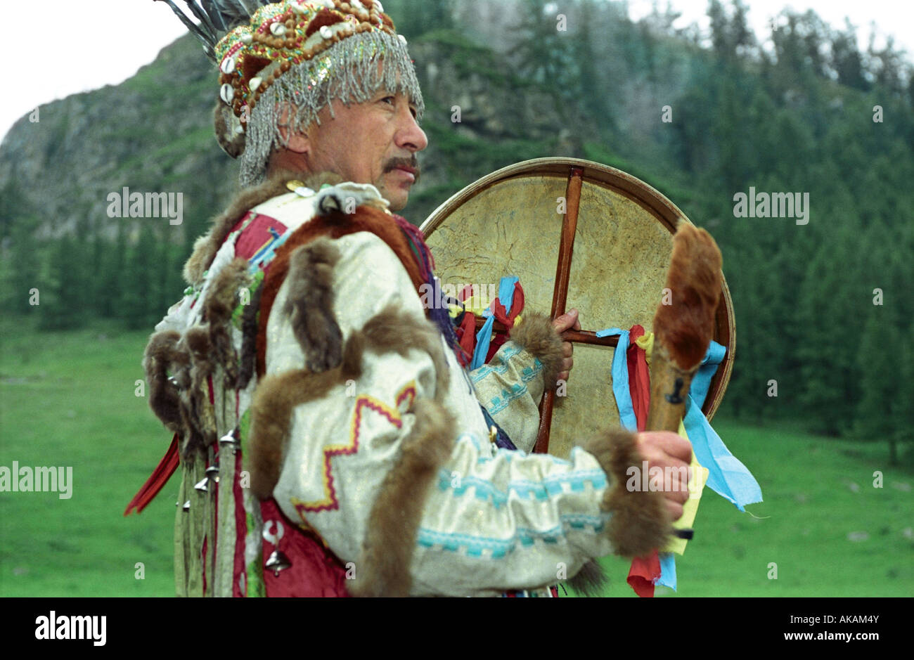Shaman is performing ritual ceremony (kamlanie). El-Oiyn national ...