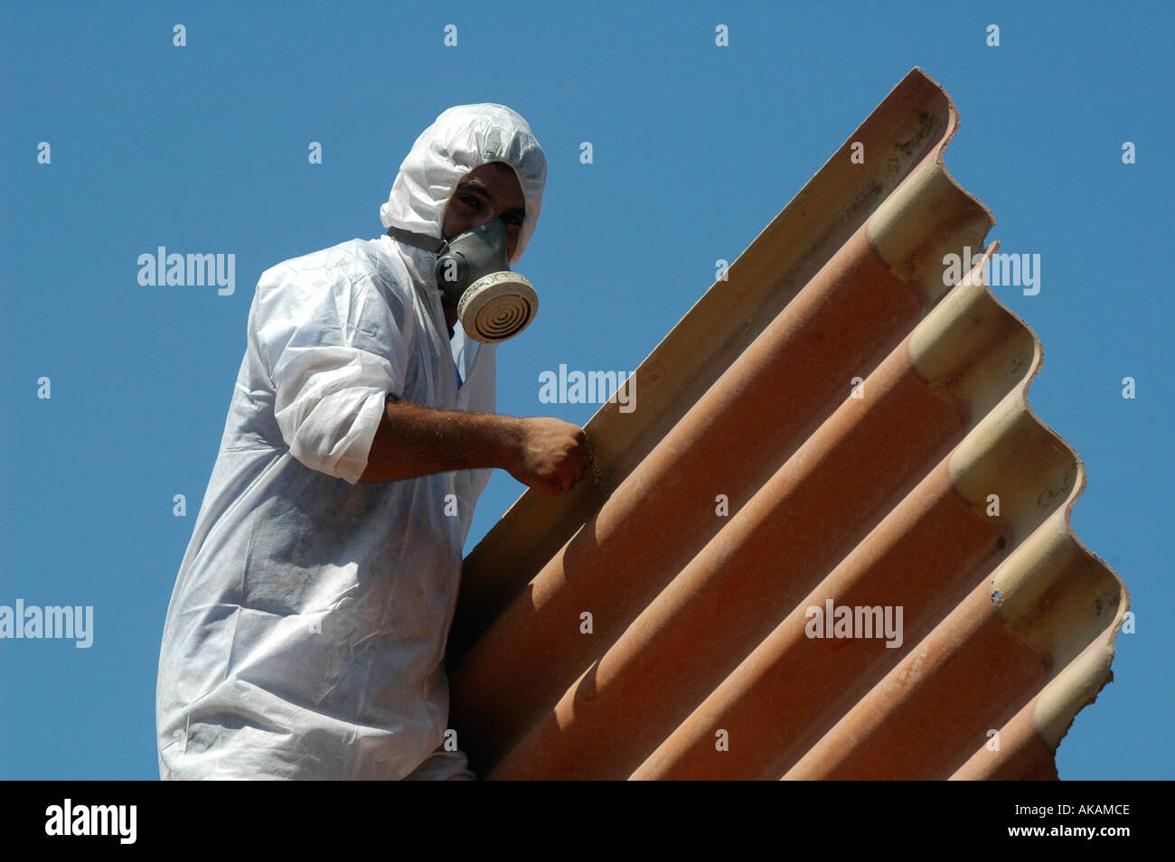 An Israeli worker wearing protective clothing and protective mask ...