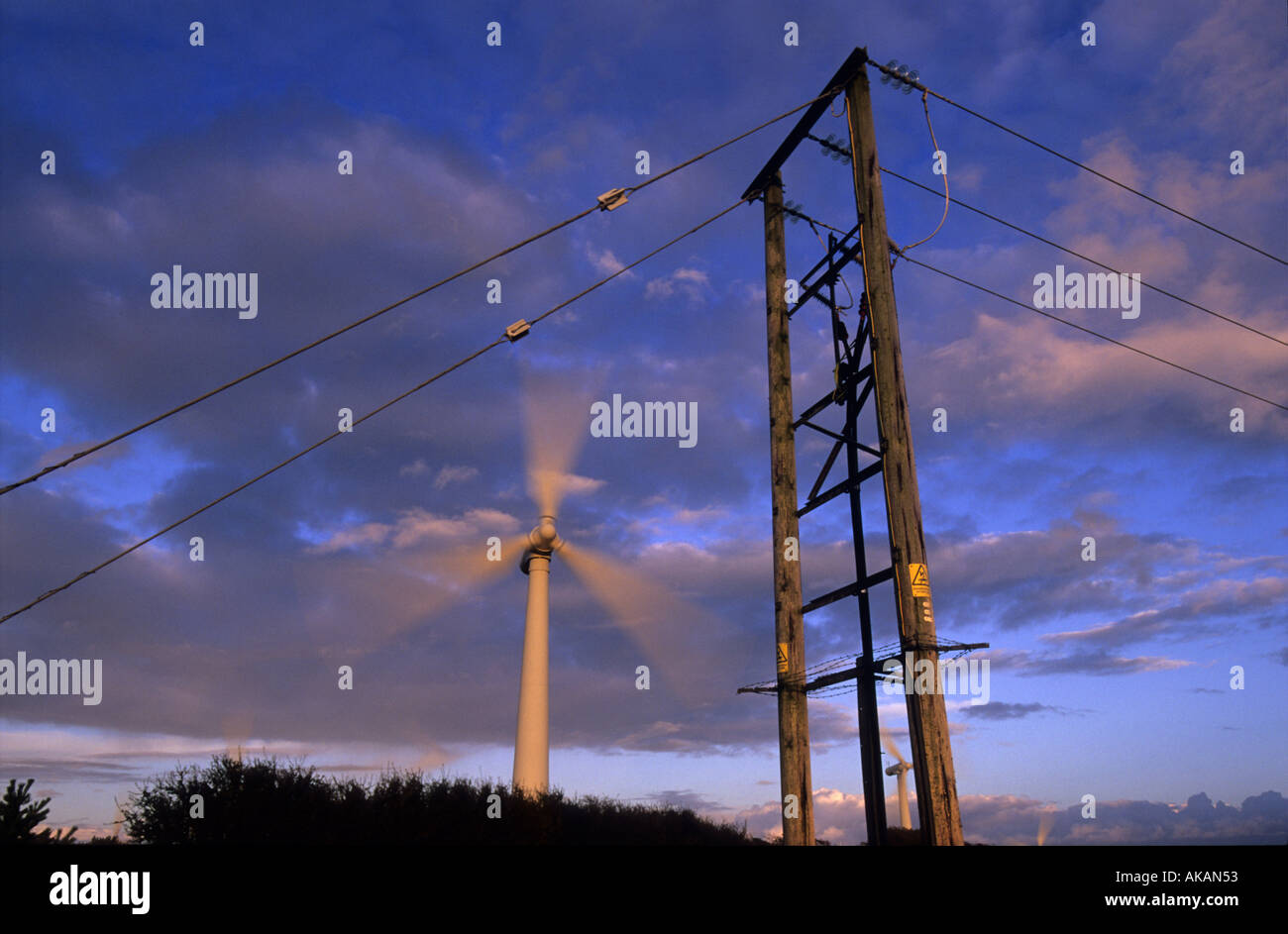 Wind turbine and power lines Anglesey Wales UK Stock Photo - Alamy