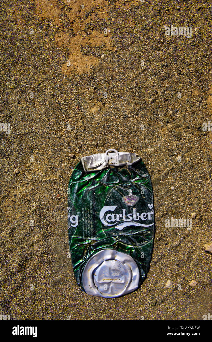 squashed can carlsberg lager beer alcohol tyre tracks dusty road ...
