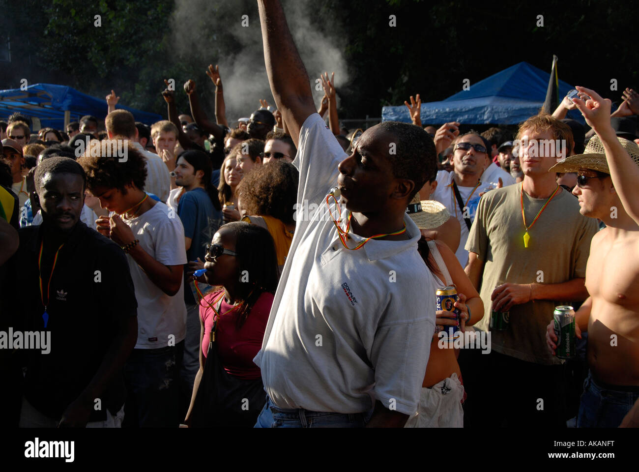 Multicultural group dancing in back street at Notting hill carnival ...