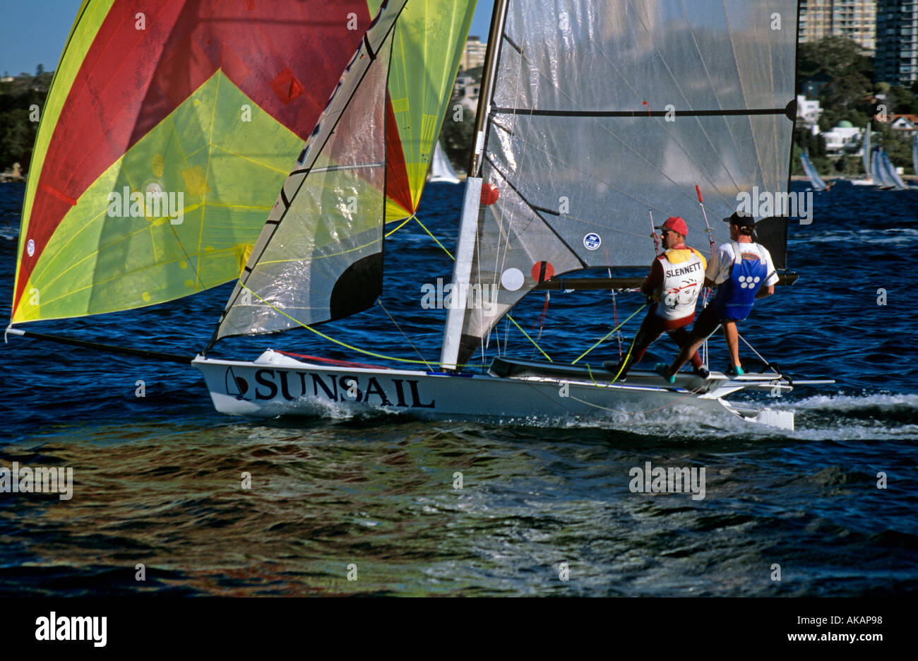 49er sailing in Sydney Harbour with both crew hike out on wings with ...