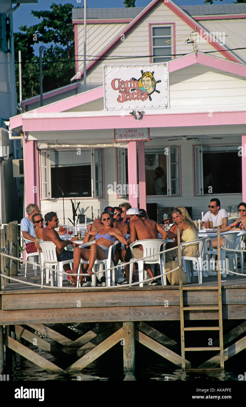 People sitting in sun in tropical buildings Hopetown Bahamas Stock ...