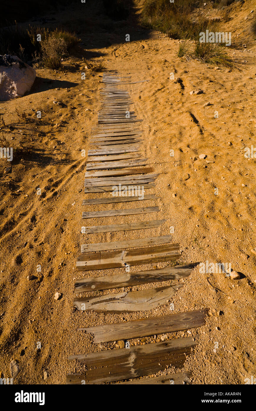Wooden tracks in sand Stock Photo - Alamy