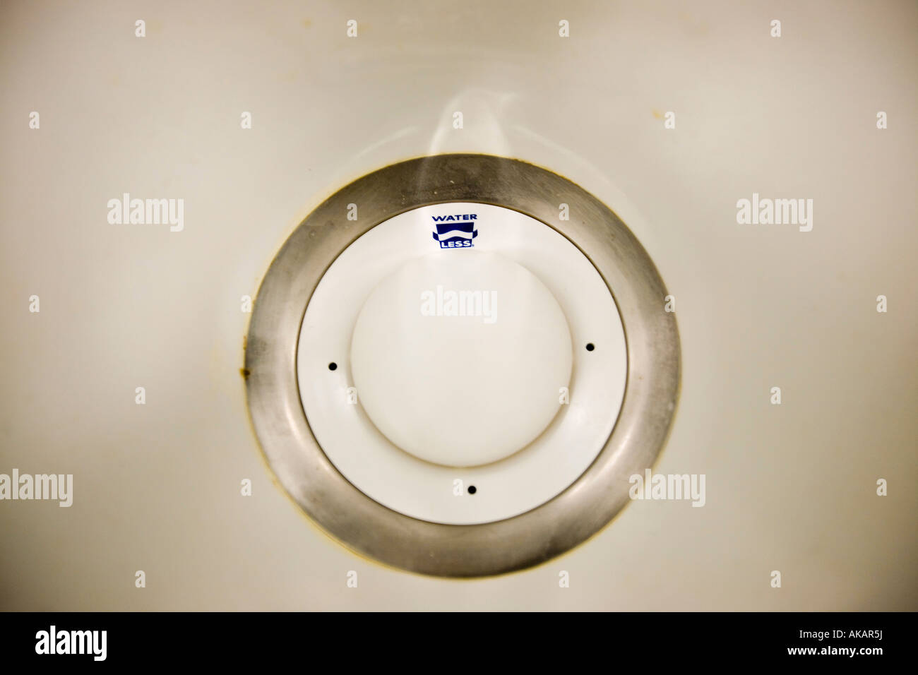 A gents urinal that is part of a waterless system using no water to ...