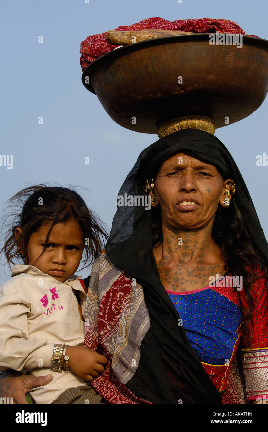Rabari woman wearing her everyday colourful dress and jewellery with ...