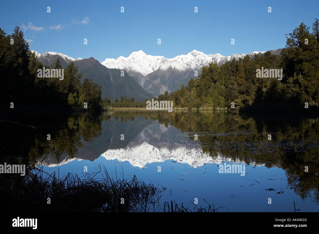 Summits of Mt Tasman left and Aoraki Mt Cook right reflected in Lake ...