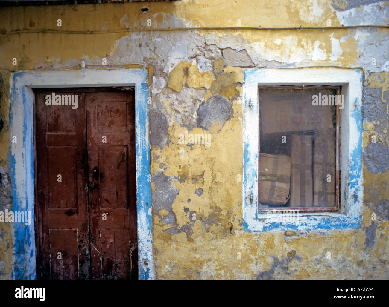 Old broken painted derelict building in Greece Stock Photo - Alamy
