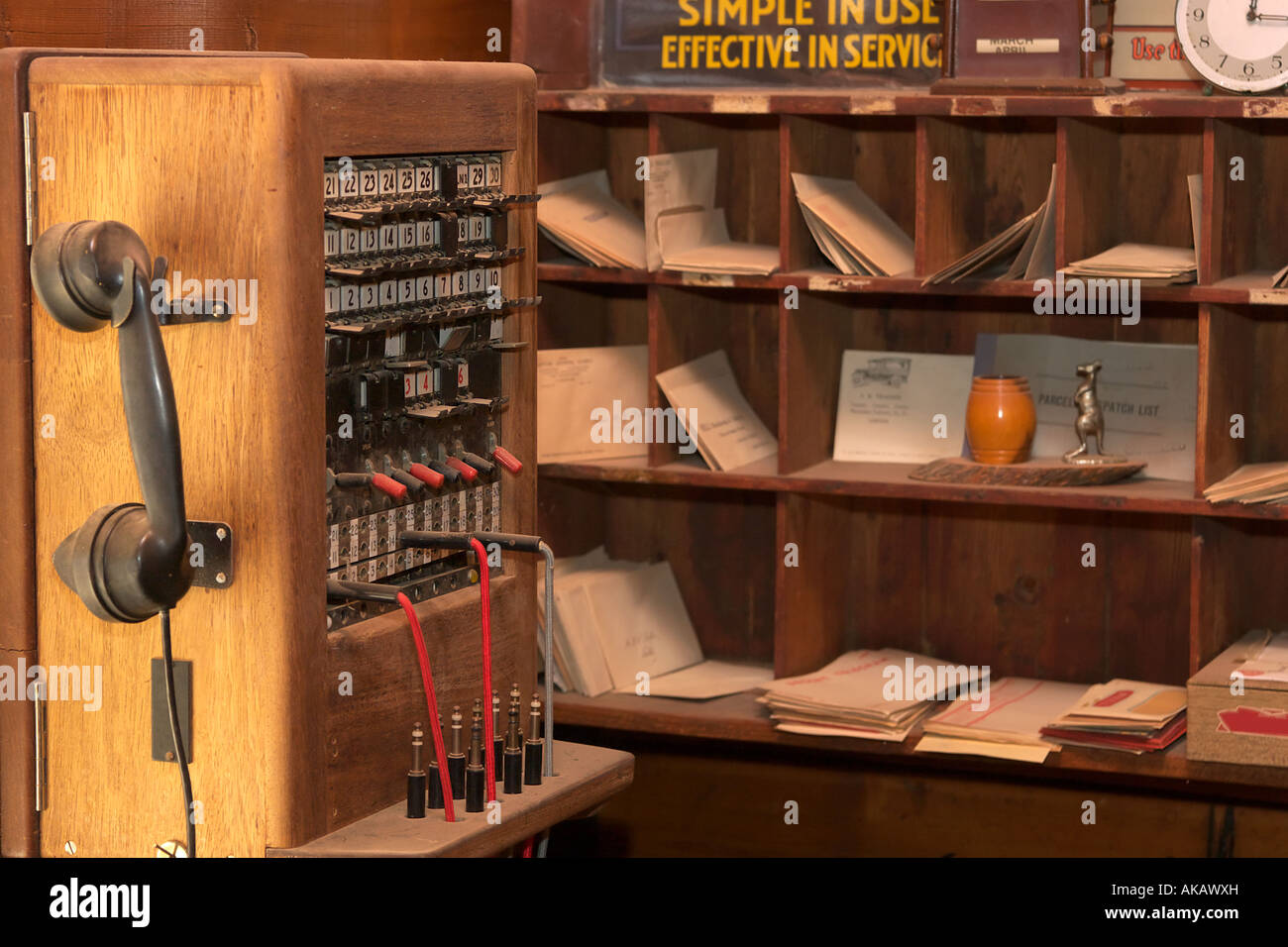 a very old wall telephone in front of mail sorting boxes Stock Photo ...
