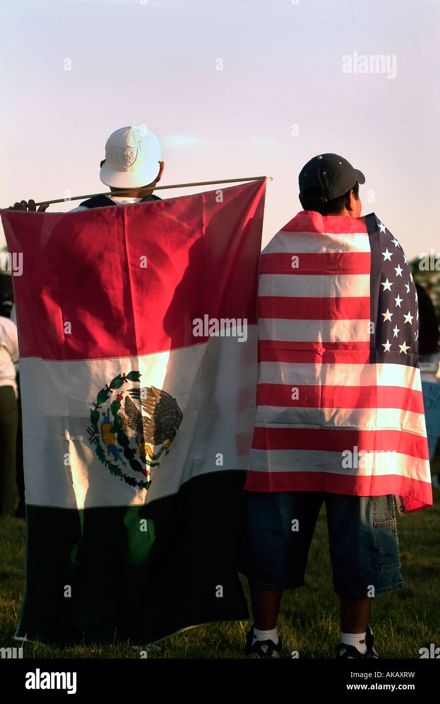 Two Hispanics wearing Mexican and American flags during a Demonstration ...