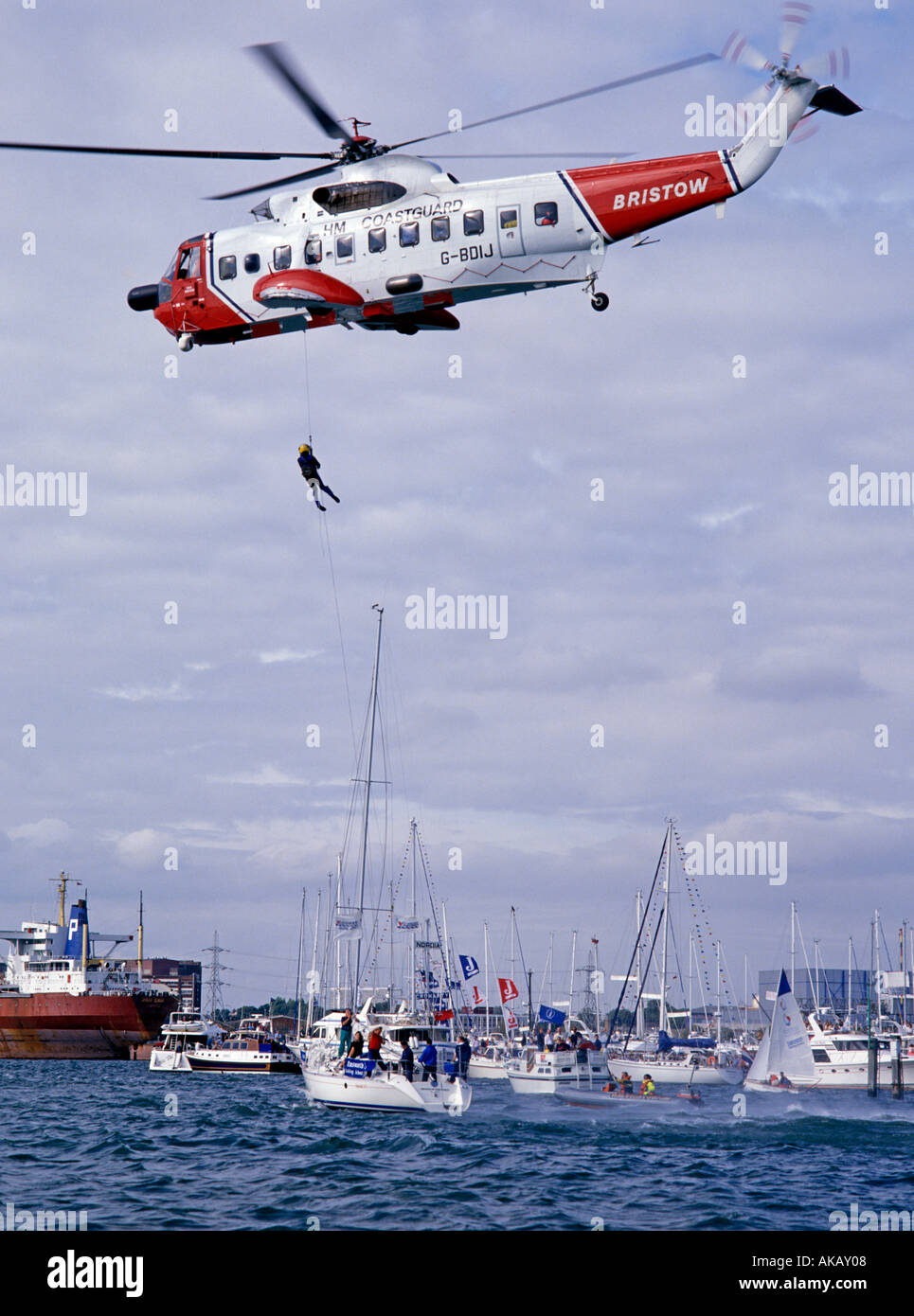 Bristows Air Sea Rescue helicopter lifting person on wire Stock Photo ...