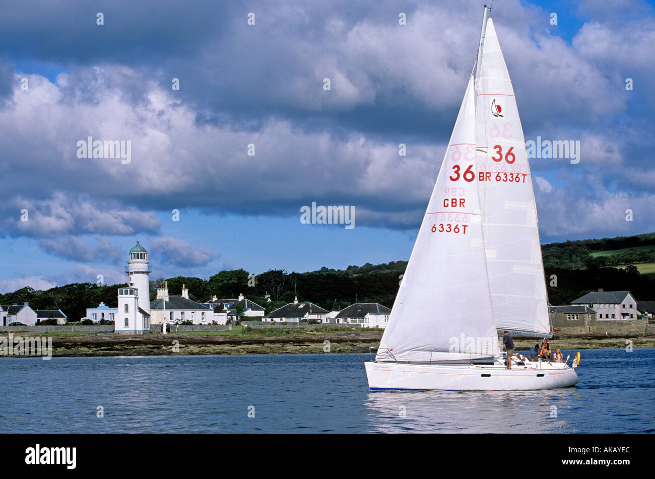 Yacht sailing at Toward Point in the West coast of Scotland UK by white ...