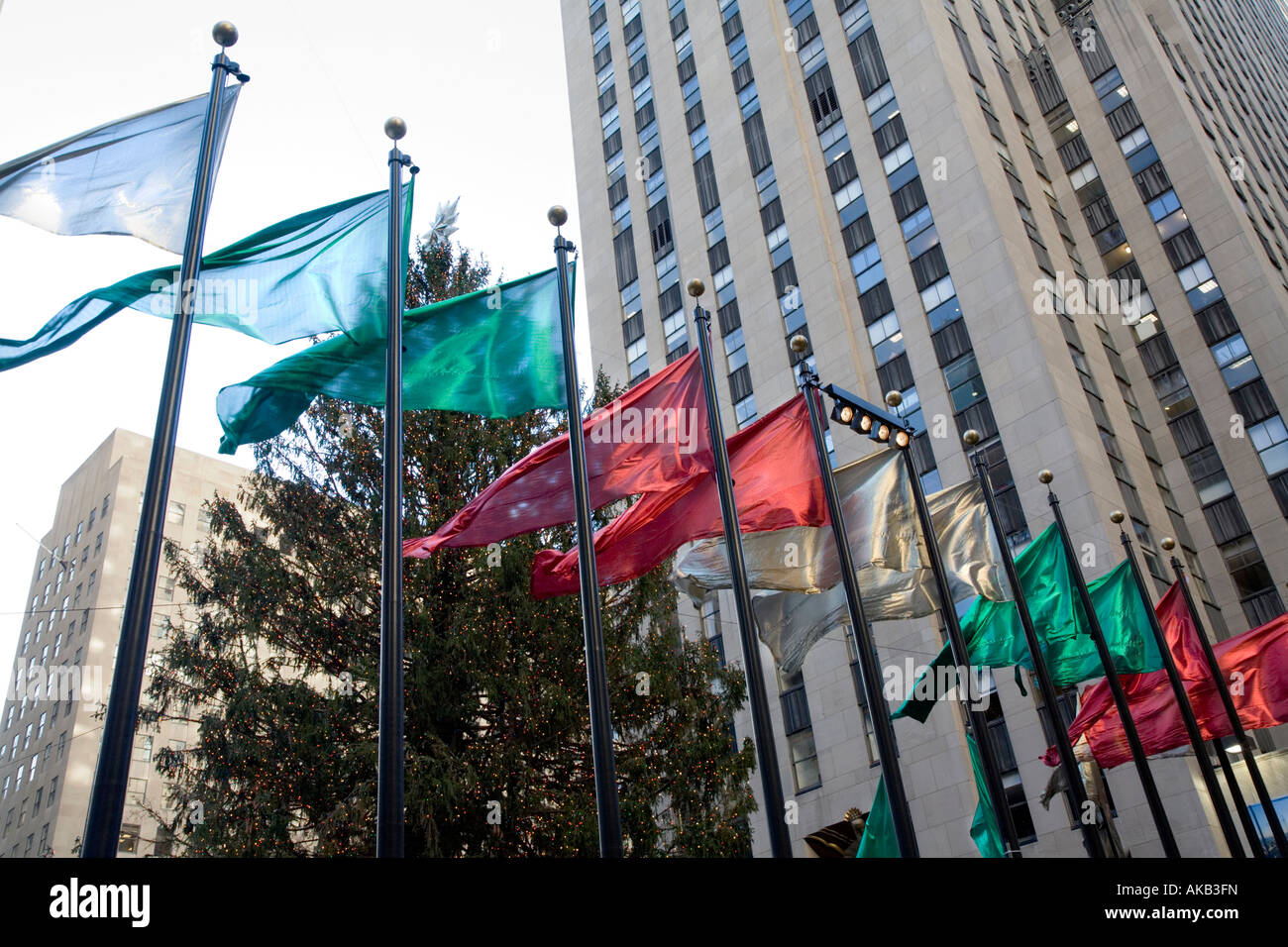 Colred flags against skyscrapper background Stock Photo - Alamy