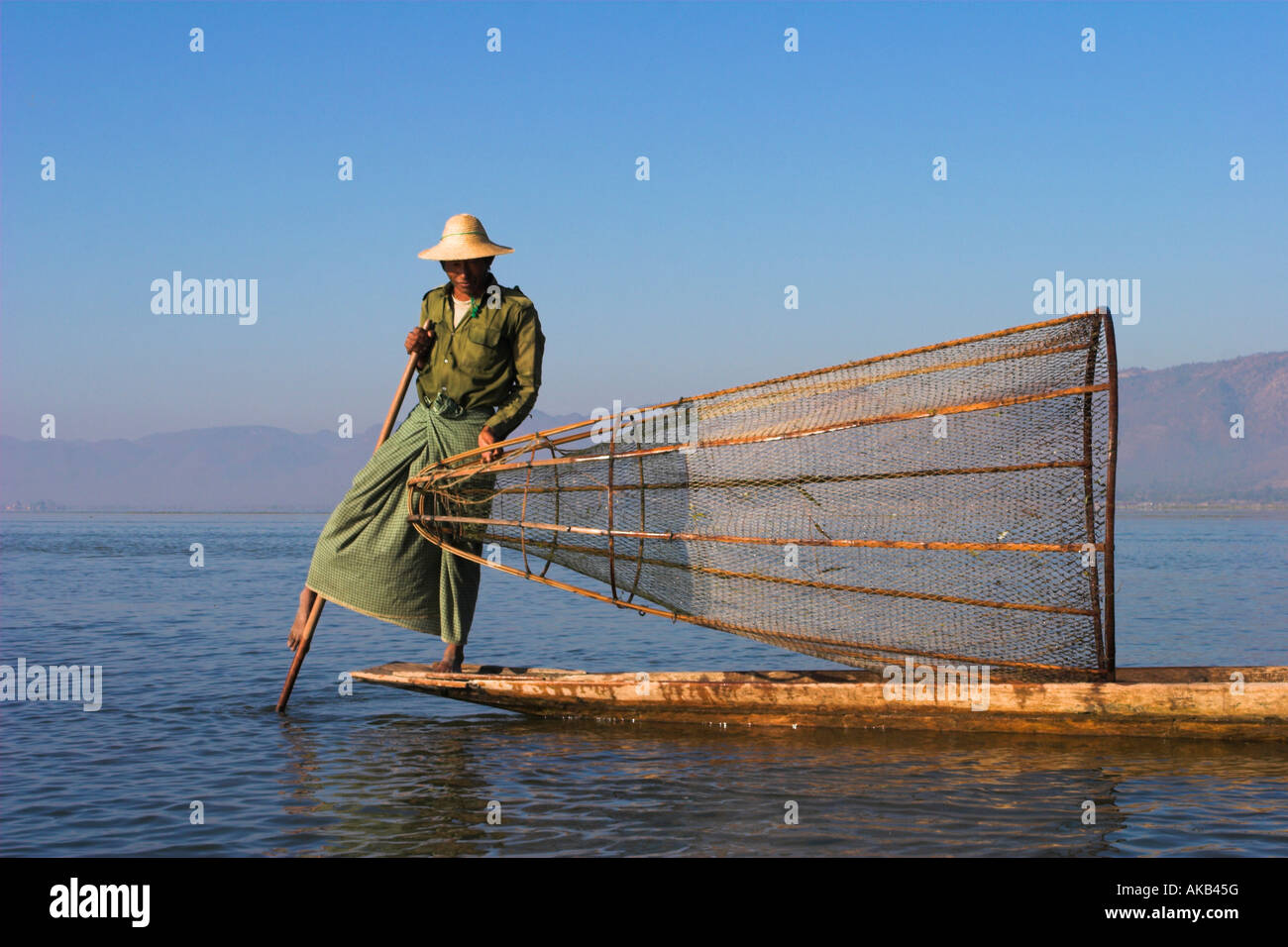 Myanmar (Burma), Shan State, Inle Lake, Intha man fishing with cone ...