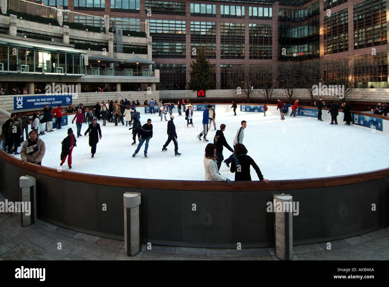 City of London Broadgate people on winter public outdoor circular ice ...