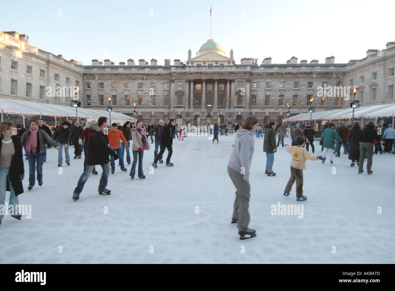 Adults & kids ice skaters with backdrop historical Somerset House ...