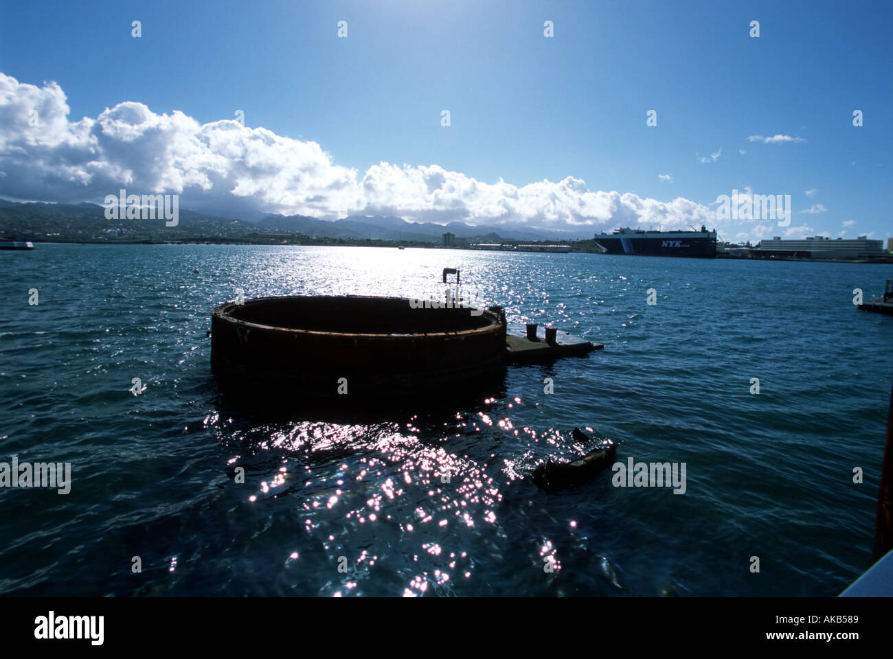 The shipwreck of the USS Arizona peeks peacefully out from her final ...