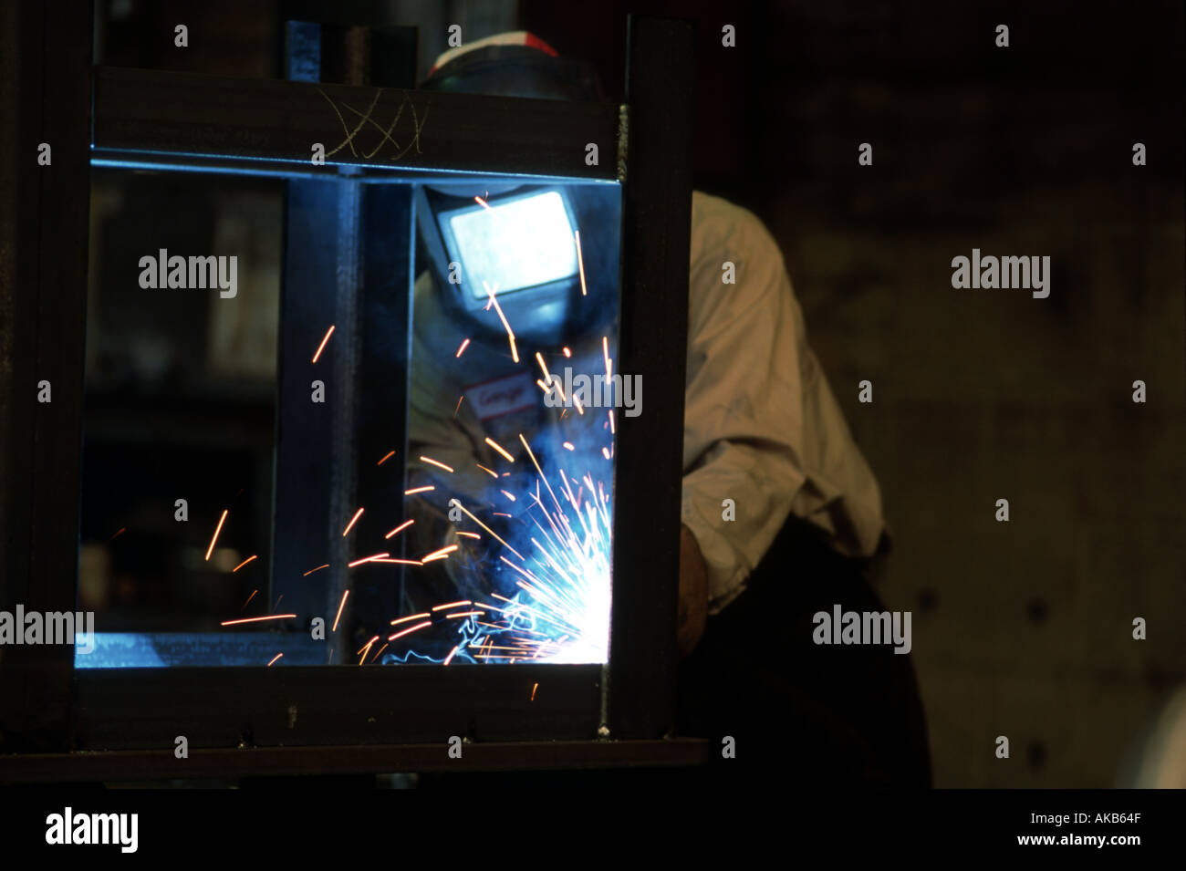 Worker in a Chicago grinding company uses cutting torch on steel Stock ...