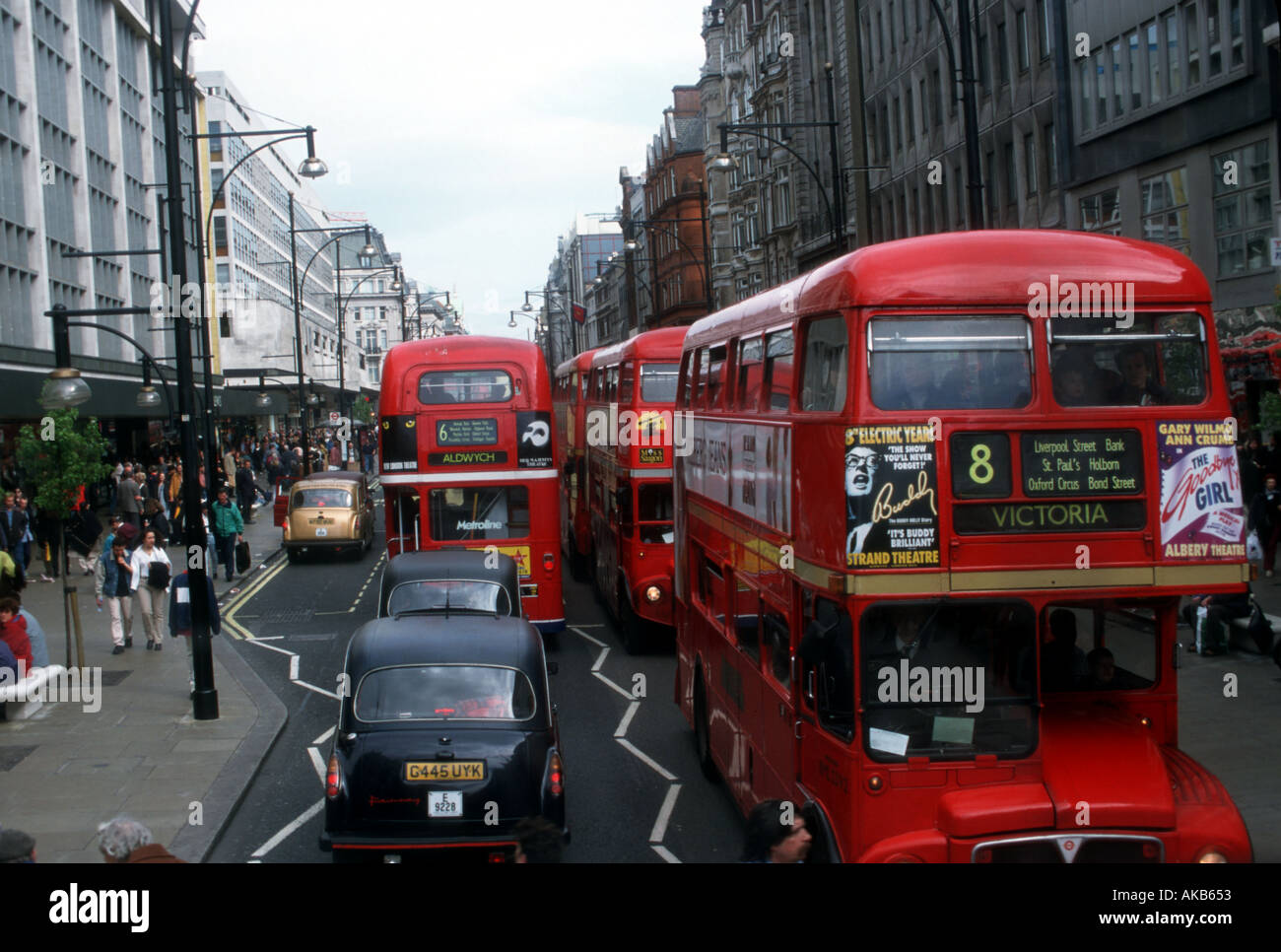 Famous Double Decker buses run through downtown London on an overcast ...