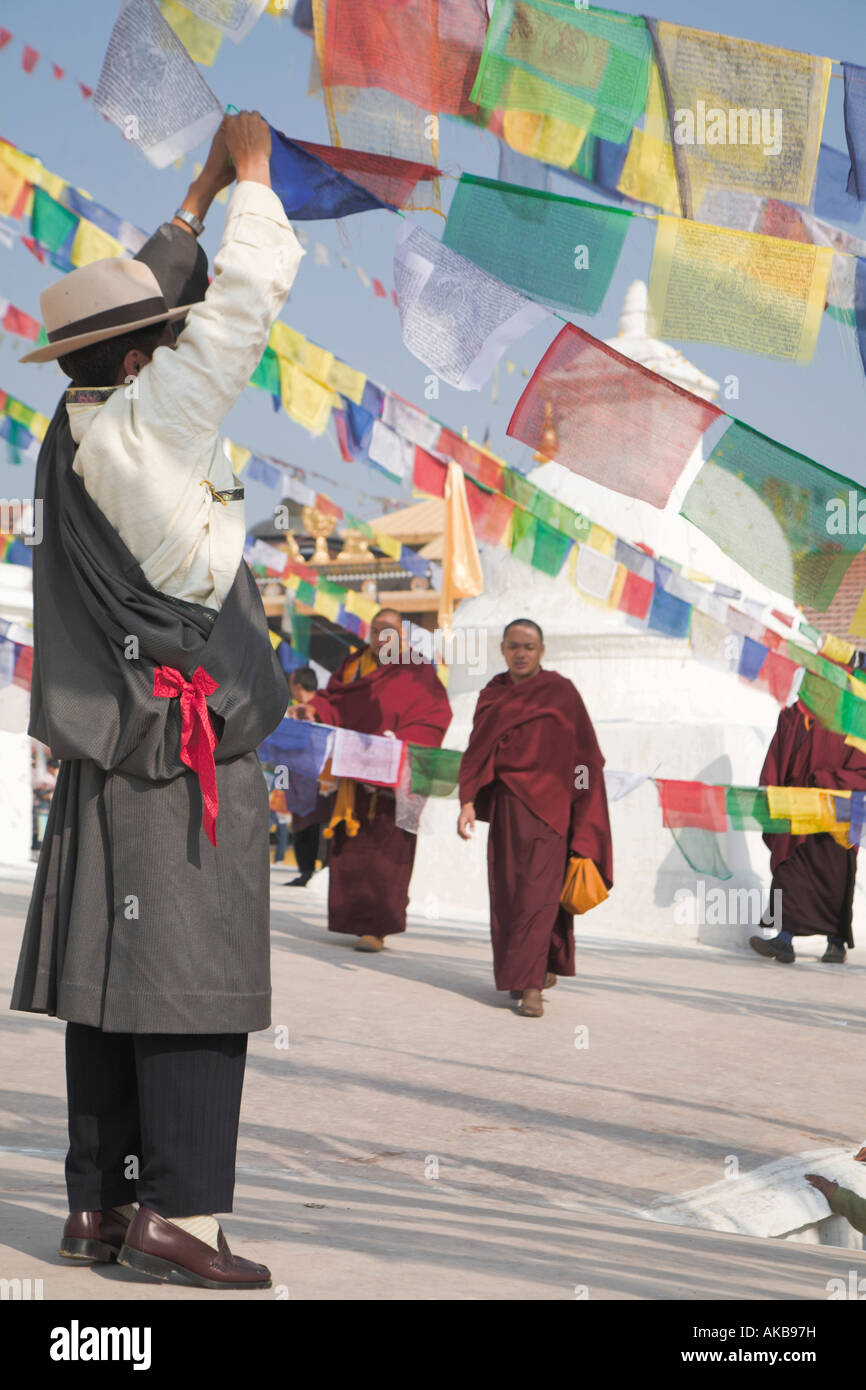 Nepal, Kathmandu, Bodhnath Buddhist stupa, Putting up prayer flags for ...
