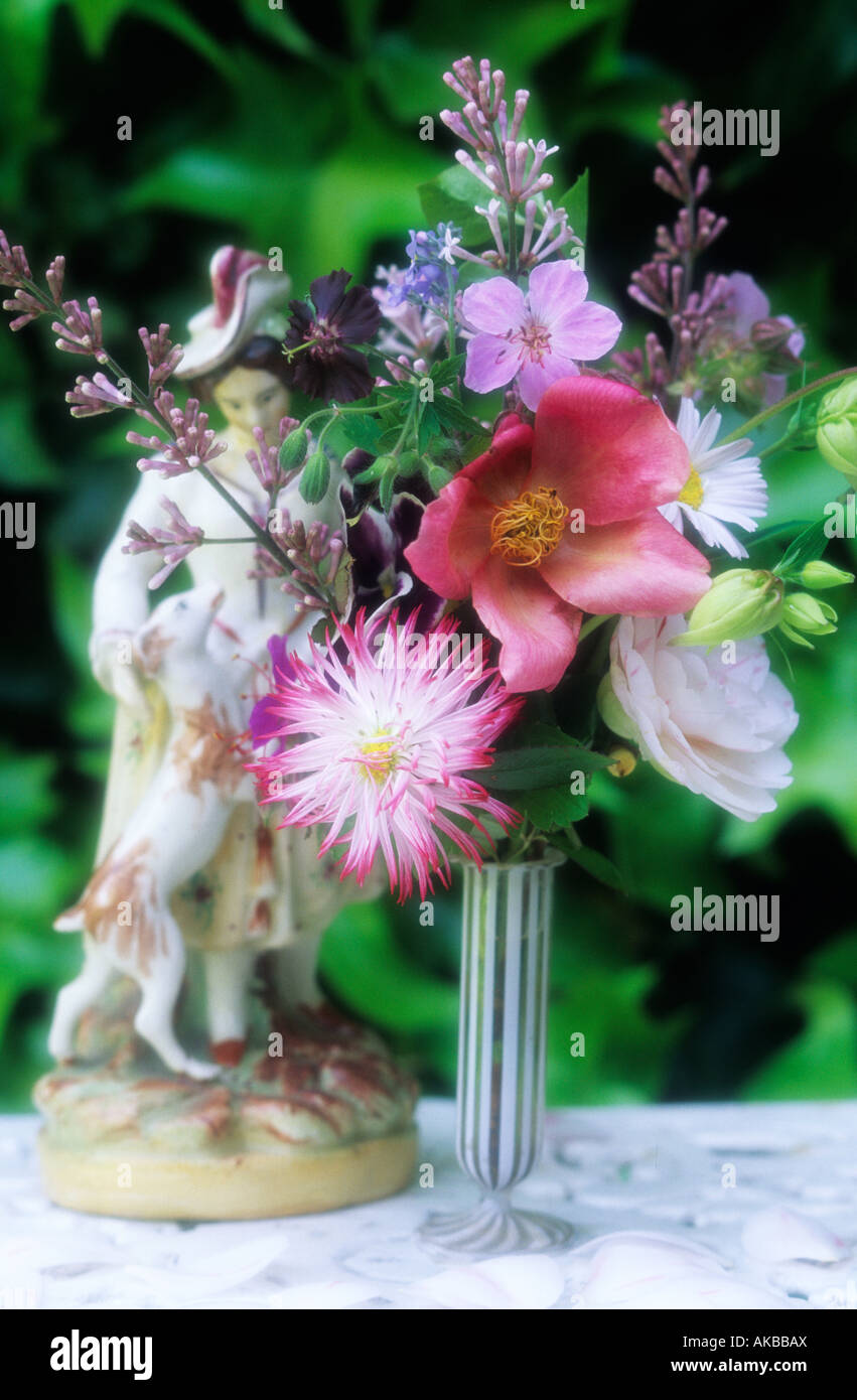 posy of Summer flowers in small glass vase on garden table Stock Photo ...