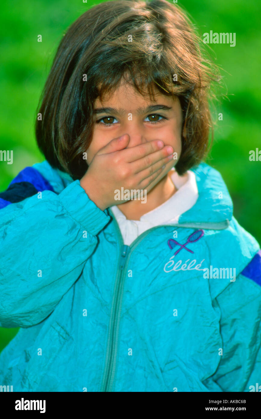 Little girl smiling facing camera Stock Photo - Alamy