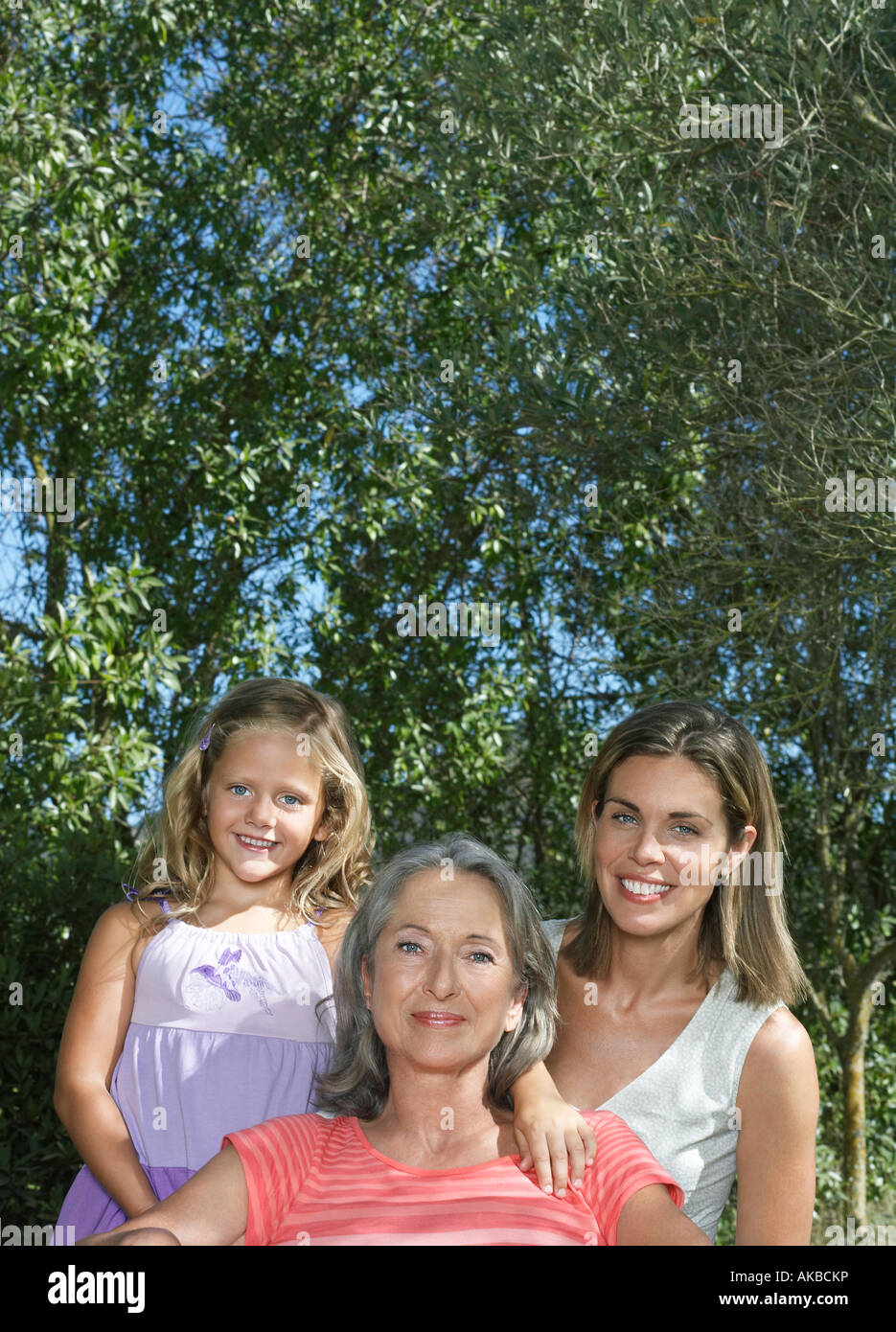 Portrait of grandmother, mother and daughter (5-6) in garden Stock ...