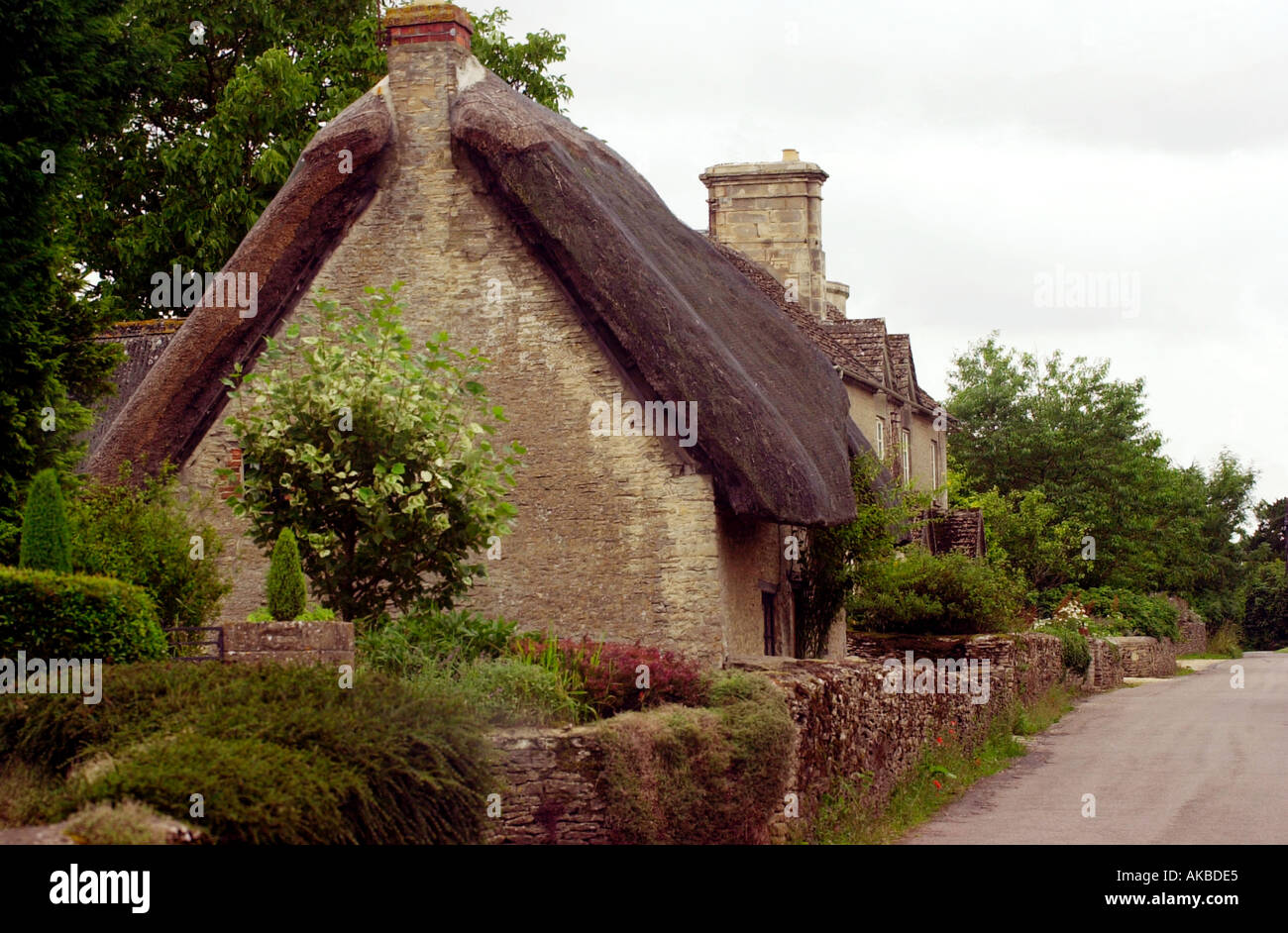 Old Thatched Cottage in a small village Stock Photo - Alamy
