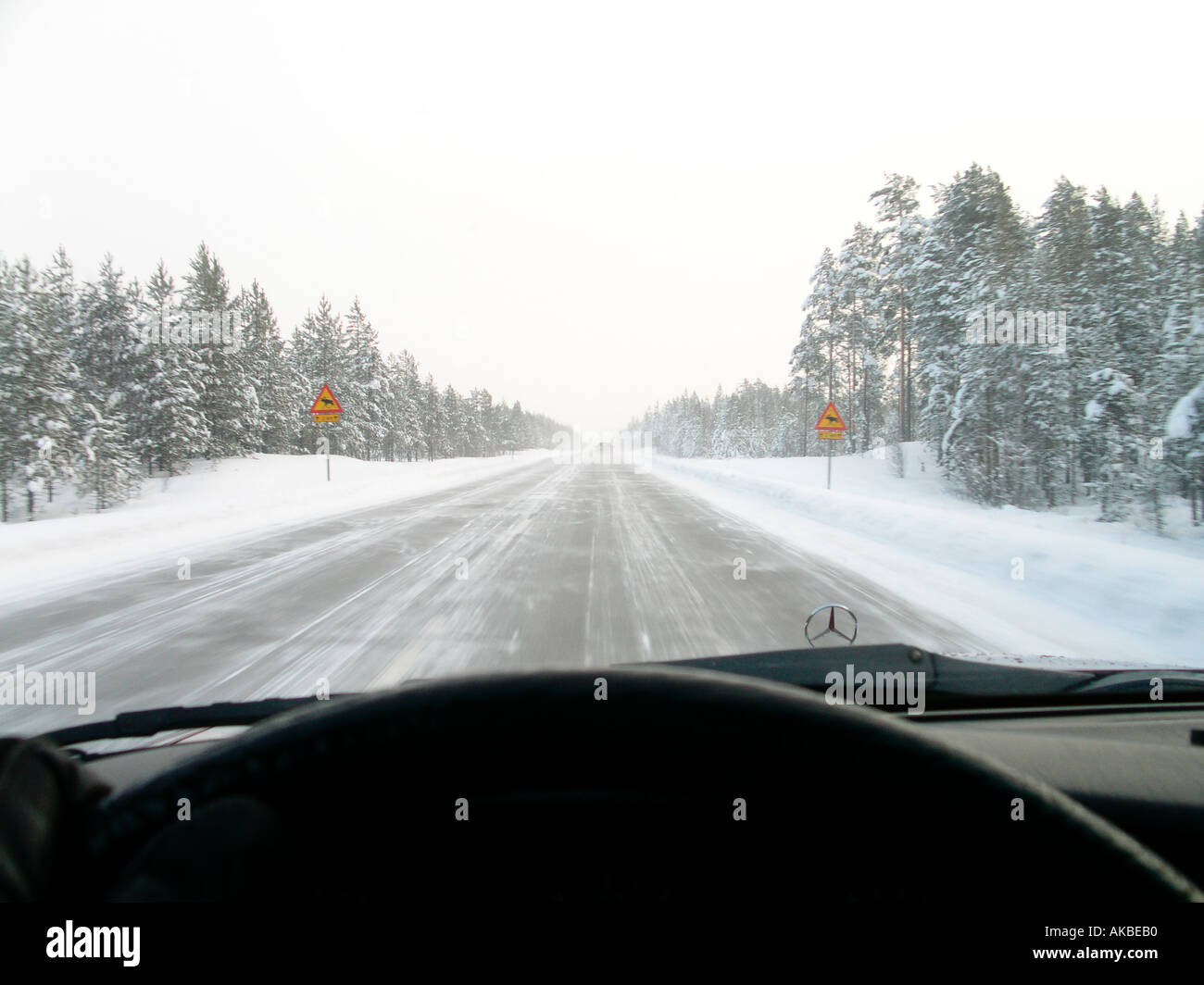 driving car on snowy road Stock Photo - Alamy