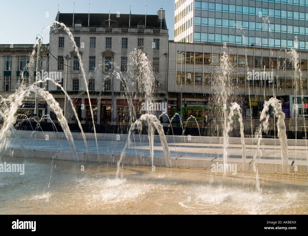 A view through the fountains to shops and buildings, the Market Square ...