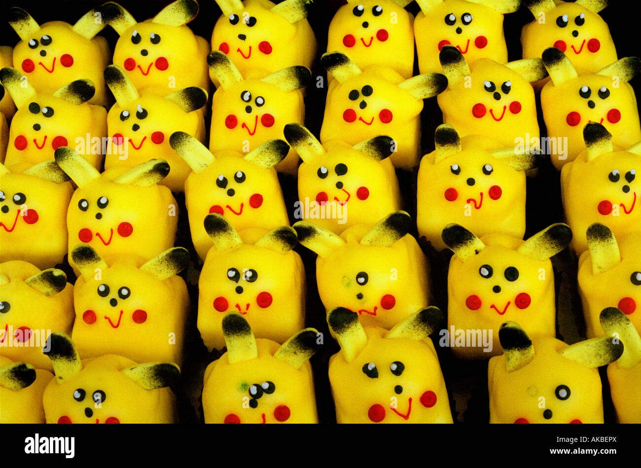 A group of bright yellow fancy cakes Stock Photo - Alamy