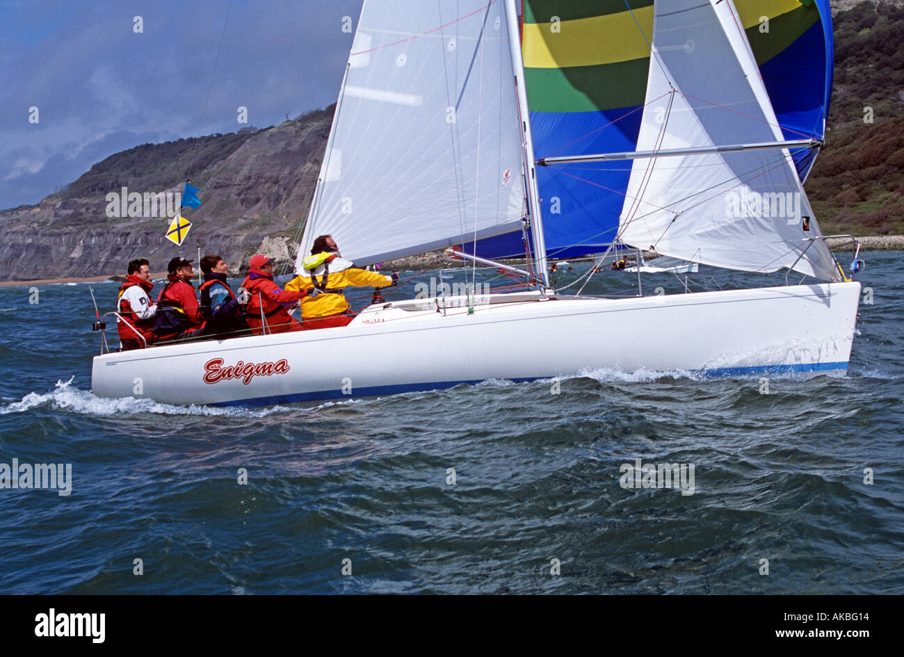 Small Yacht sailing with five crew flying spinnaker during round the ...