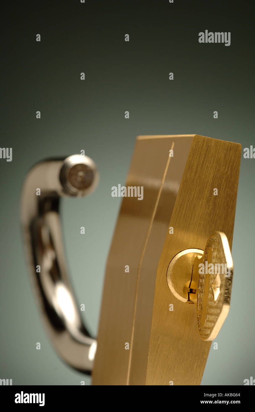 Steel and brass padlock with key open neutral background Stock Photo ...